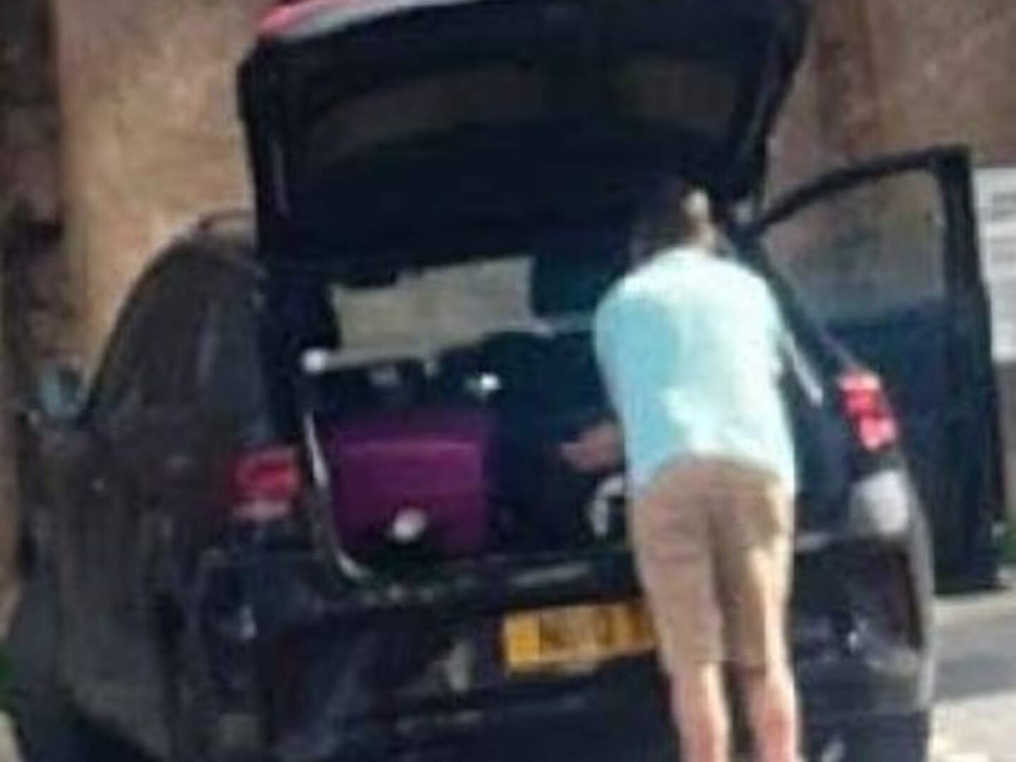 Dog breeder pictured loading cocaine-filled cases into his car at ...