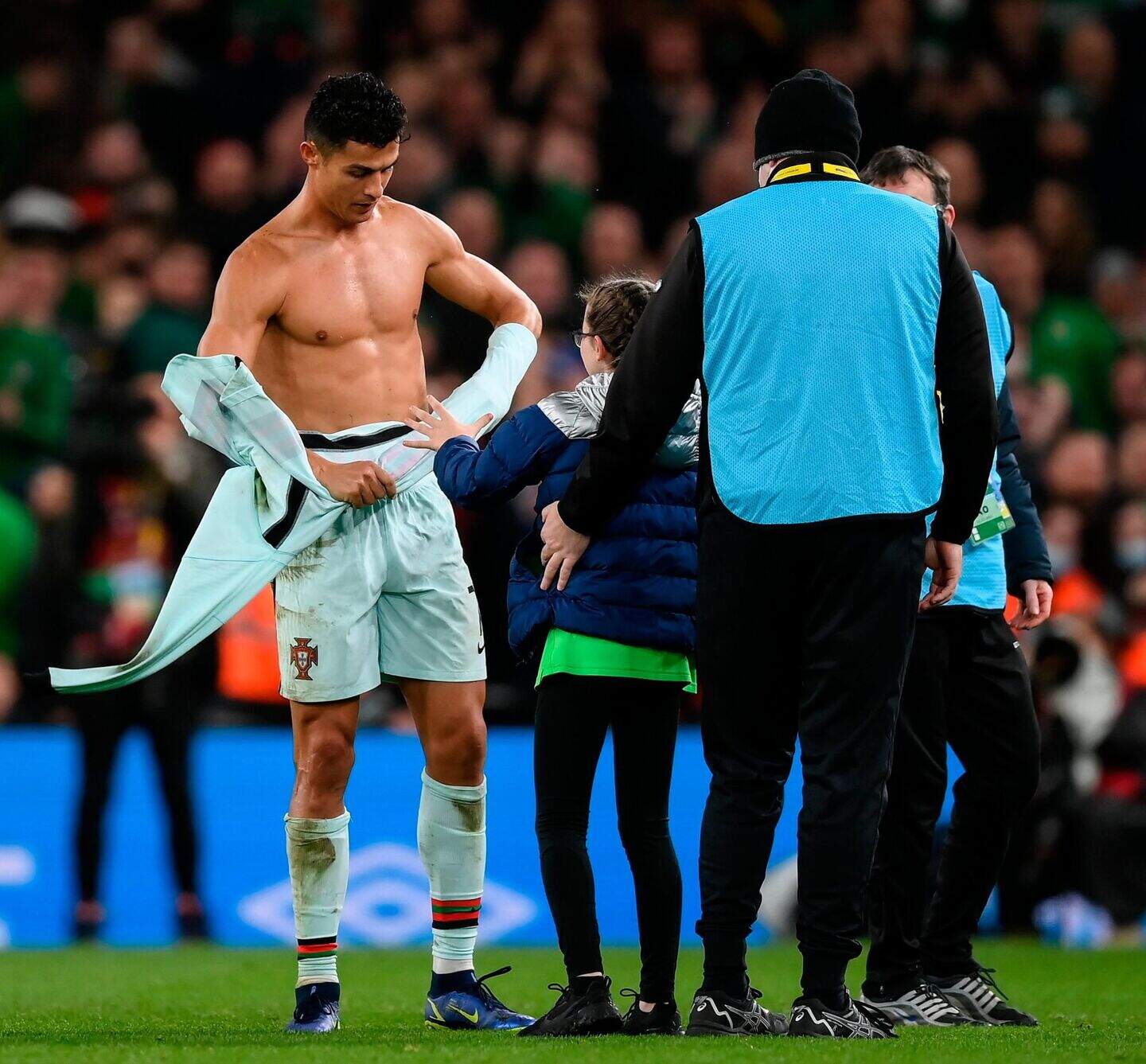 Ronaldo gives young girl the shirt off his back after she runs on to ...